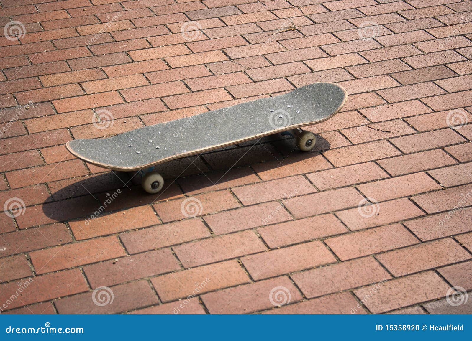 Skateboard on red bricks stock photo. Image of skate - 15358920