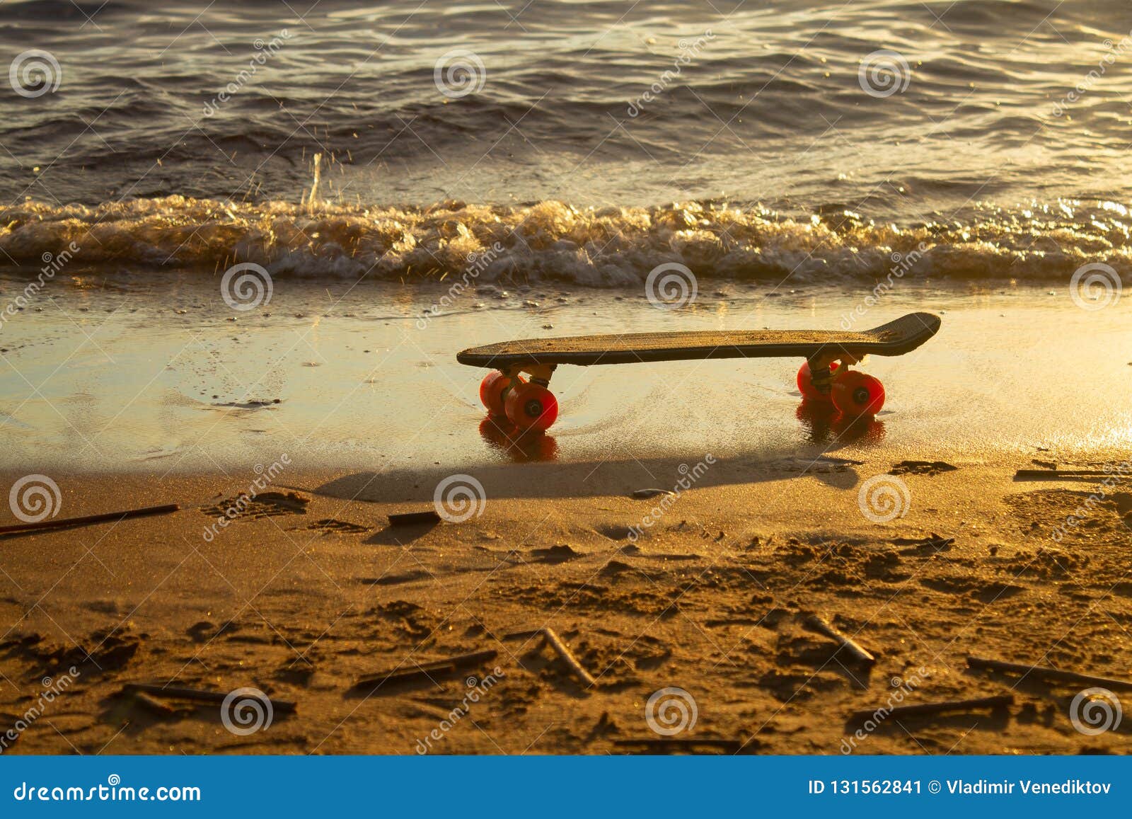 Skateboard in the Sand on the Beach at Sunset Stock Image - Image of ...