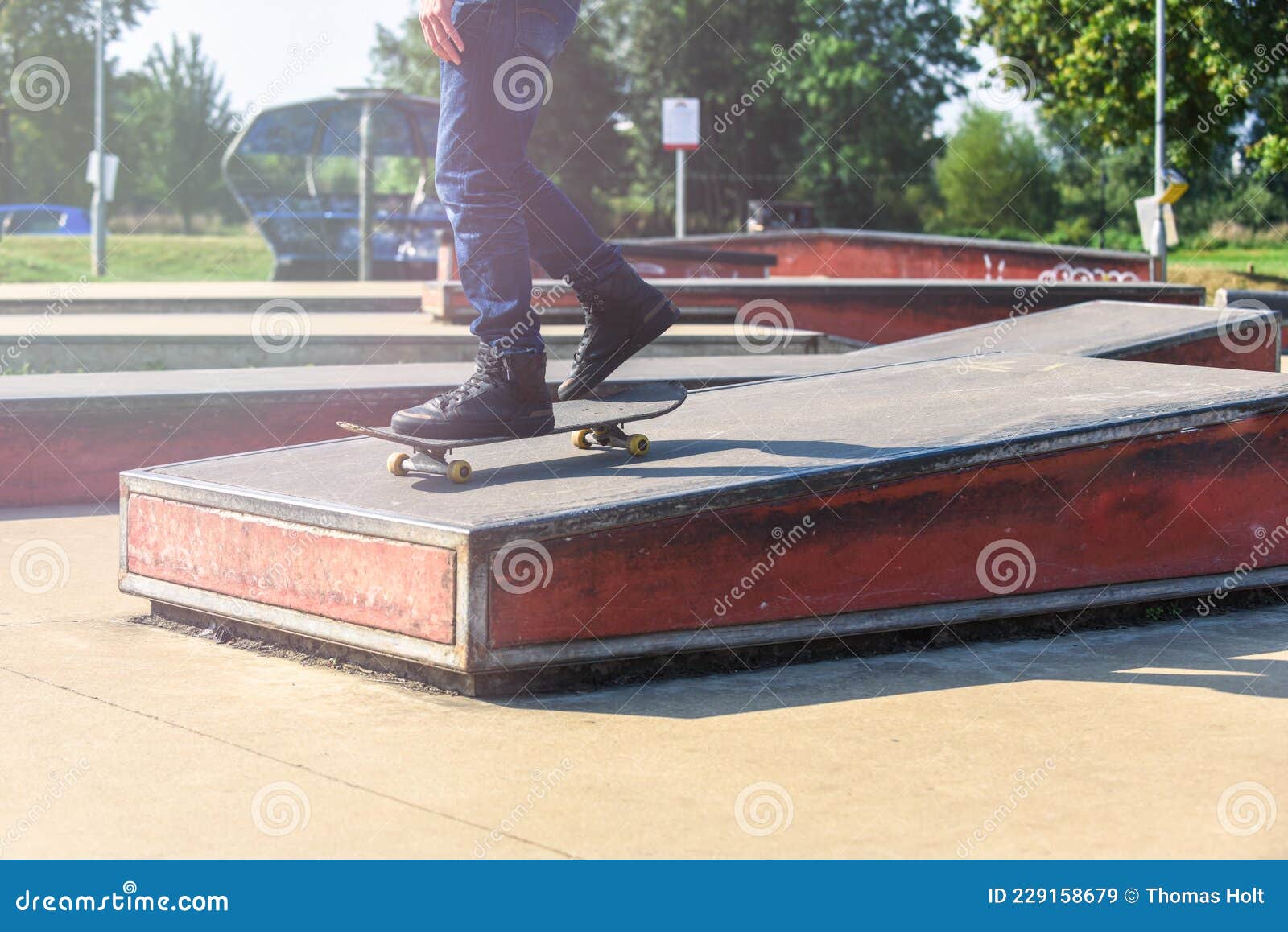 A Skateboarder in Action Doing Tricks on Ramps at a Skate Park Stock ...