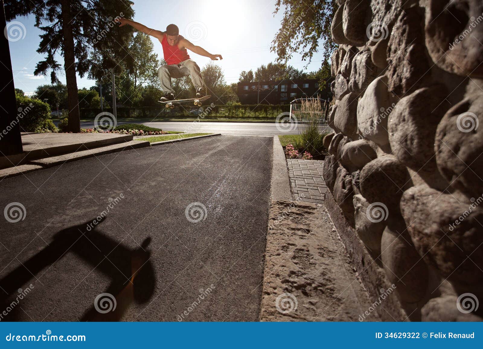 Skateboarder Doing a Ollie Trick in the Street Stock Photo - Image of ...
