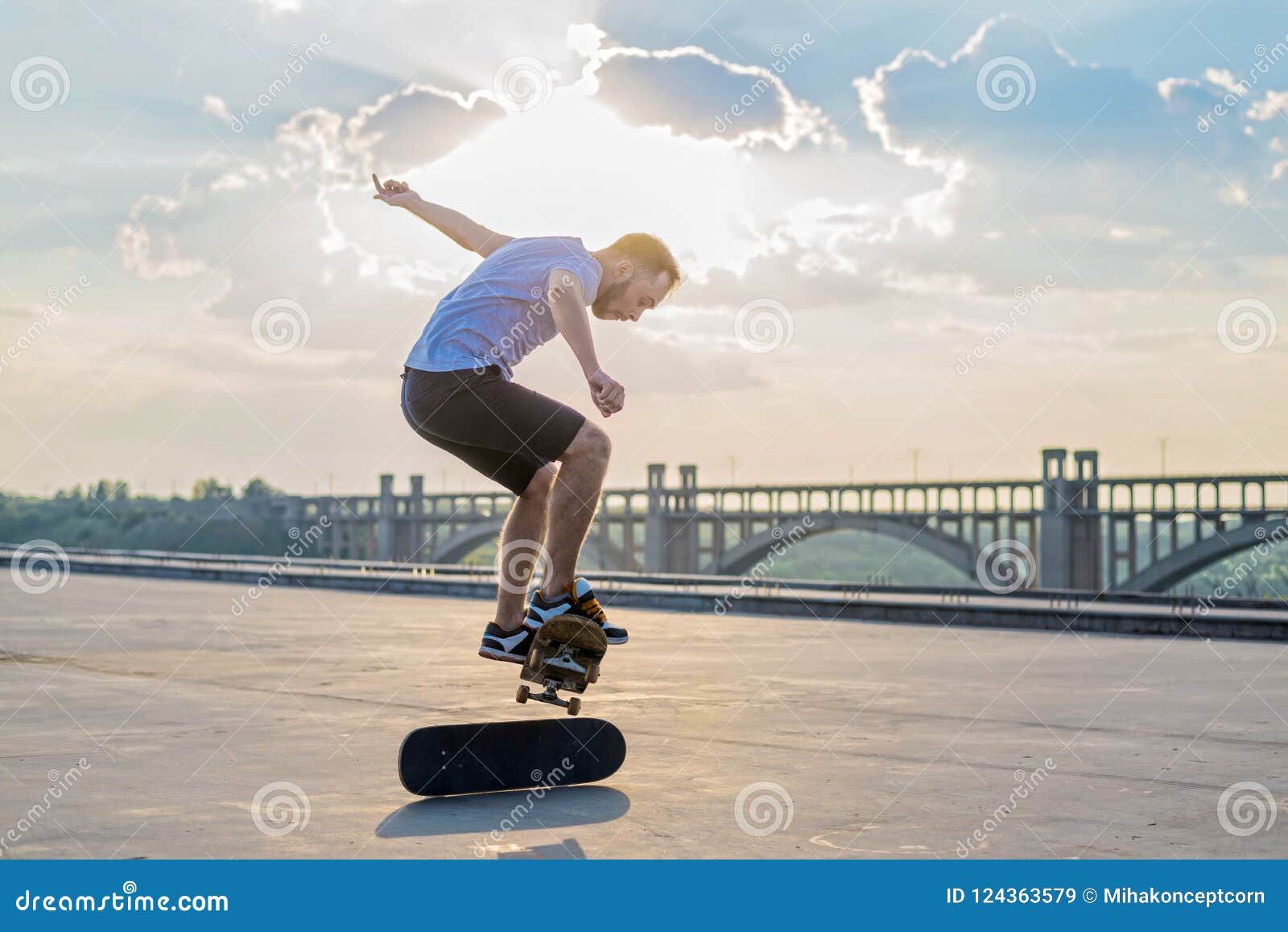 Skateboarder Doing a Trick in a Jump at Sunset. Stock Image - Image of ...