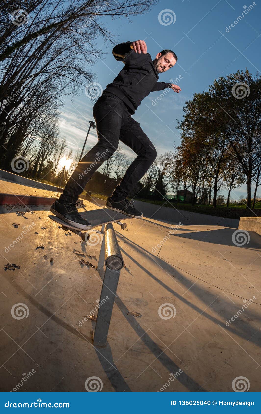 Skateboarder on a grind stock photo. Image of skateboard - 136025040