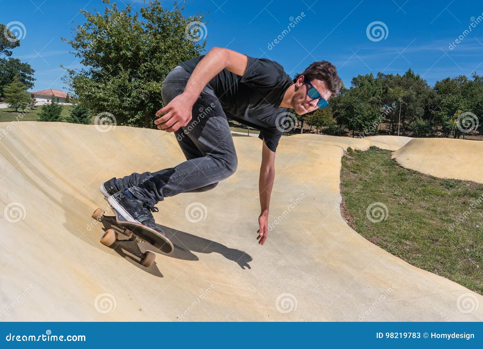 Skateboarder on a Pump Track Park Stock Image - Image of male, motion ...