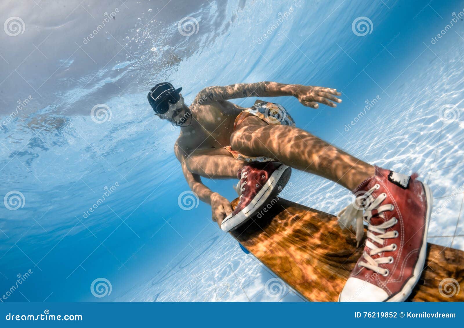 Skateboarding underwater stock photo. Image of dive, skate - 76219852