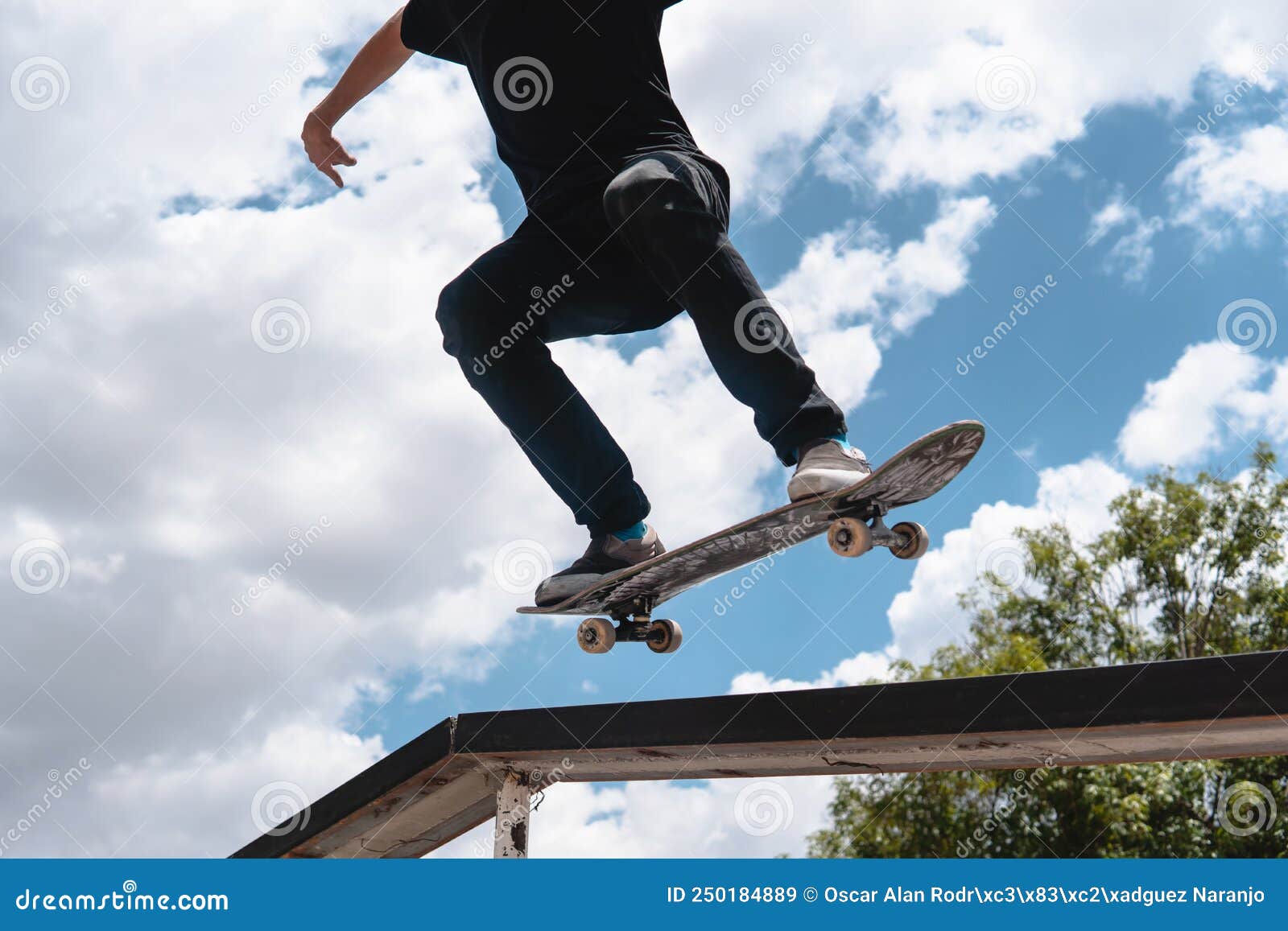Skater in the Air Doing an Impressive Trick in the Park Stock Image ...