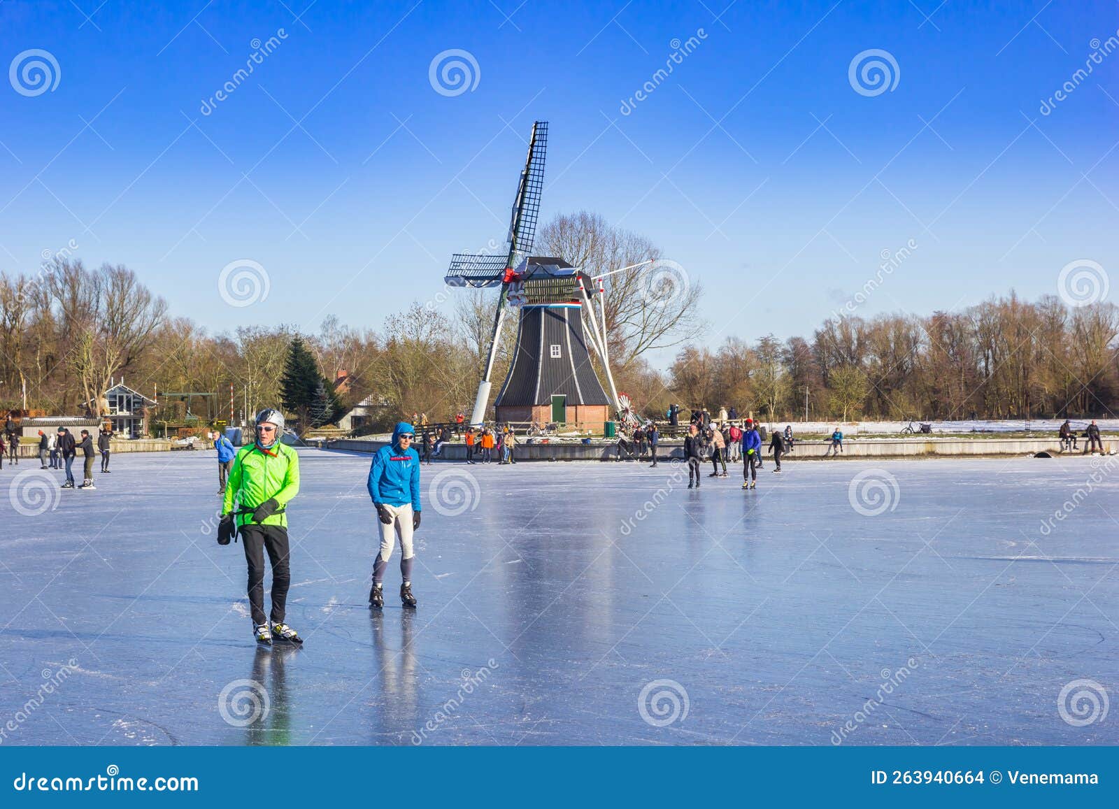 Skaters in Front of the Windmill at the Frozen Lake in Groningen ...