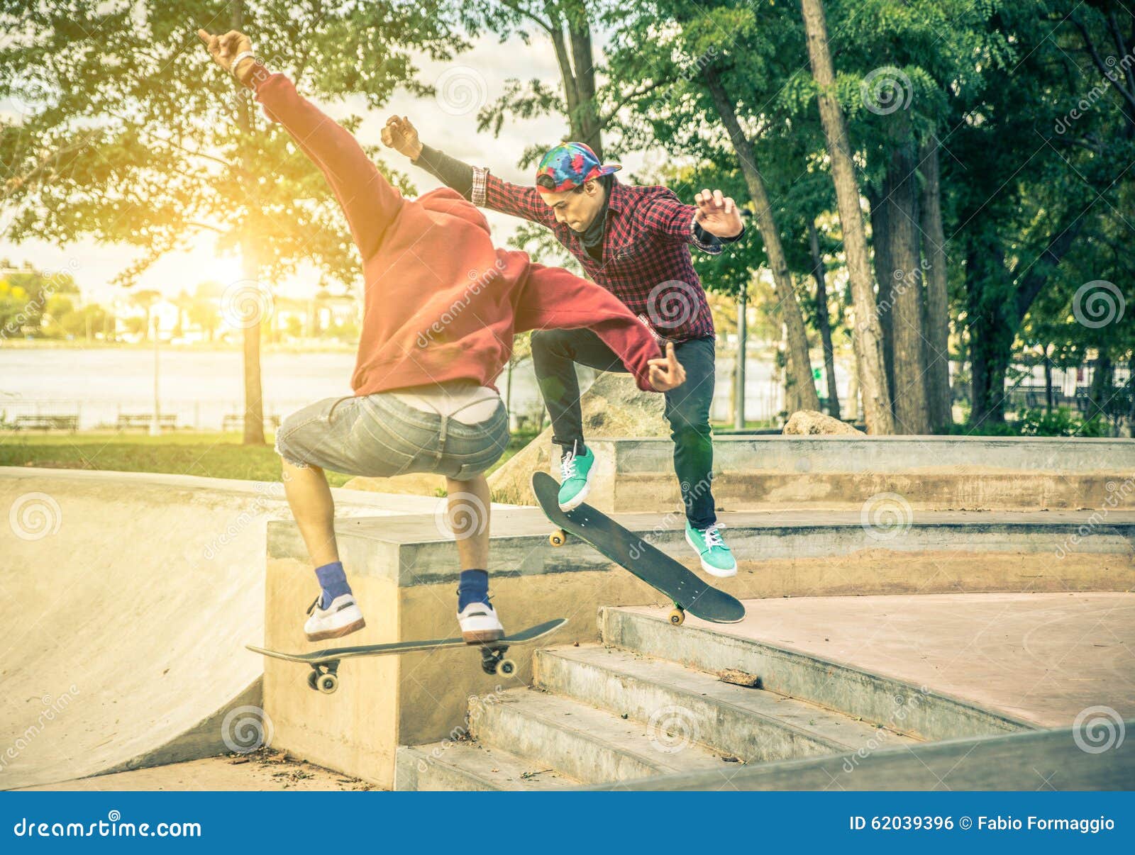 Skaters performing tricks stock photo. Image of friendship - 62039396