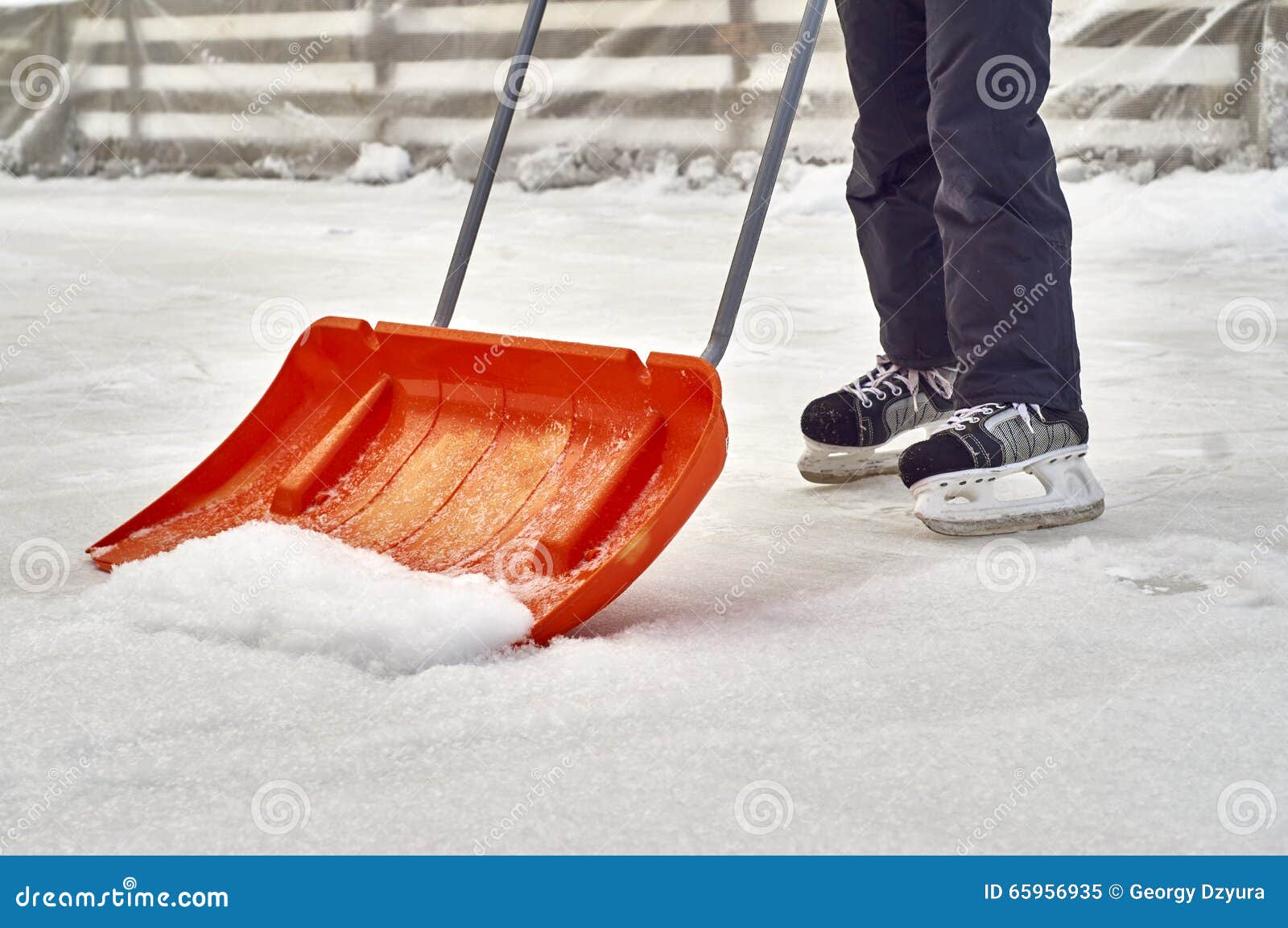 Skating Boy Cleaning a Rink Stock Image - Image of jacket, frost: 65956935