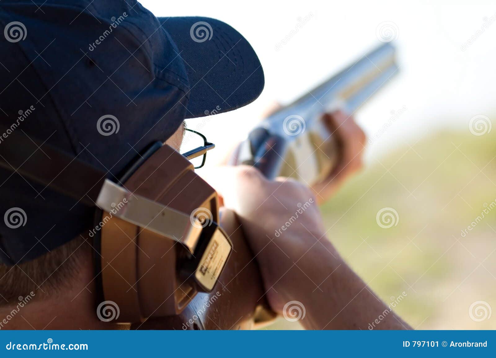 Skeet Shooting. Hunter Aiming Rifle In Forest. Hunter With Shotgun Gun ...