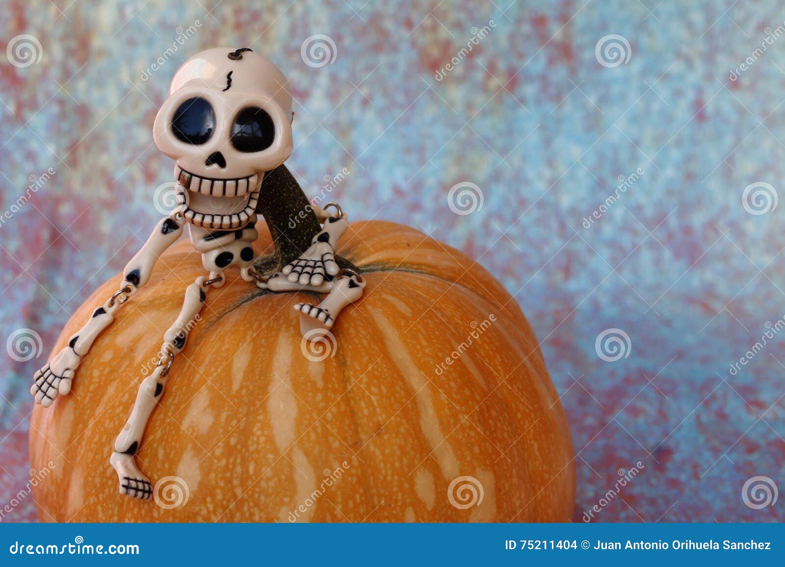 SKELETON BIG HEAD SITTING on a PUMPKIN Stock Photo - Image of ...