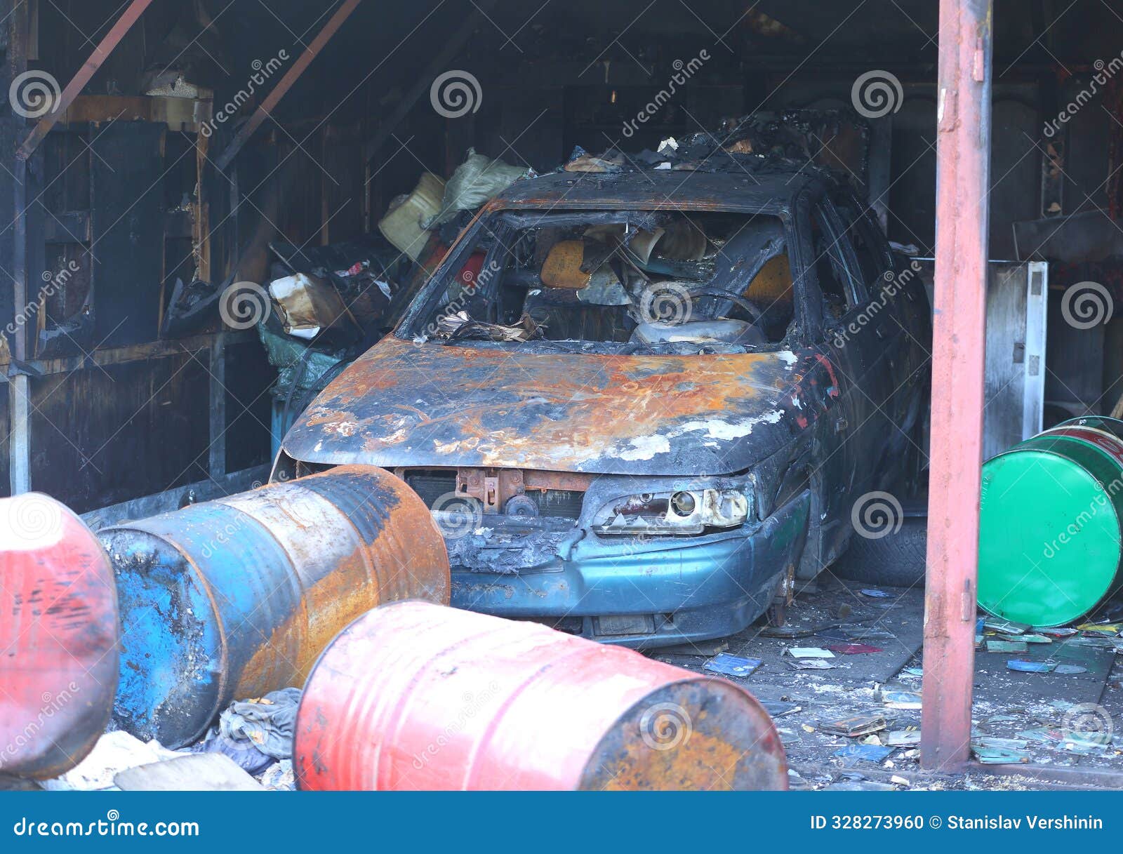 Skeleton of a Burnt-out Car Stands in a Destroyed Garage Stock Photo ...