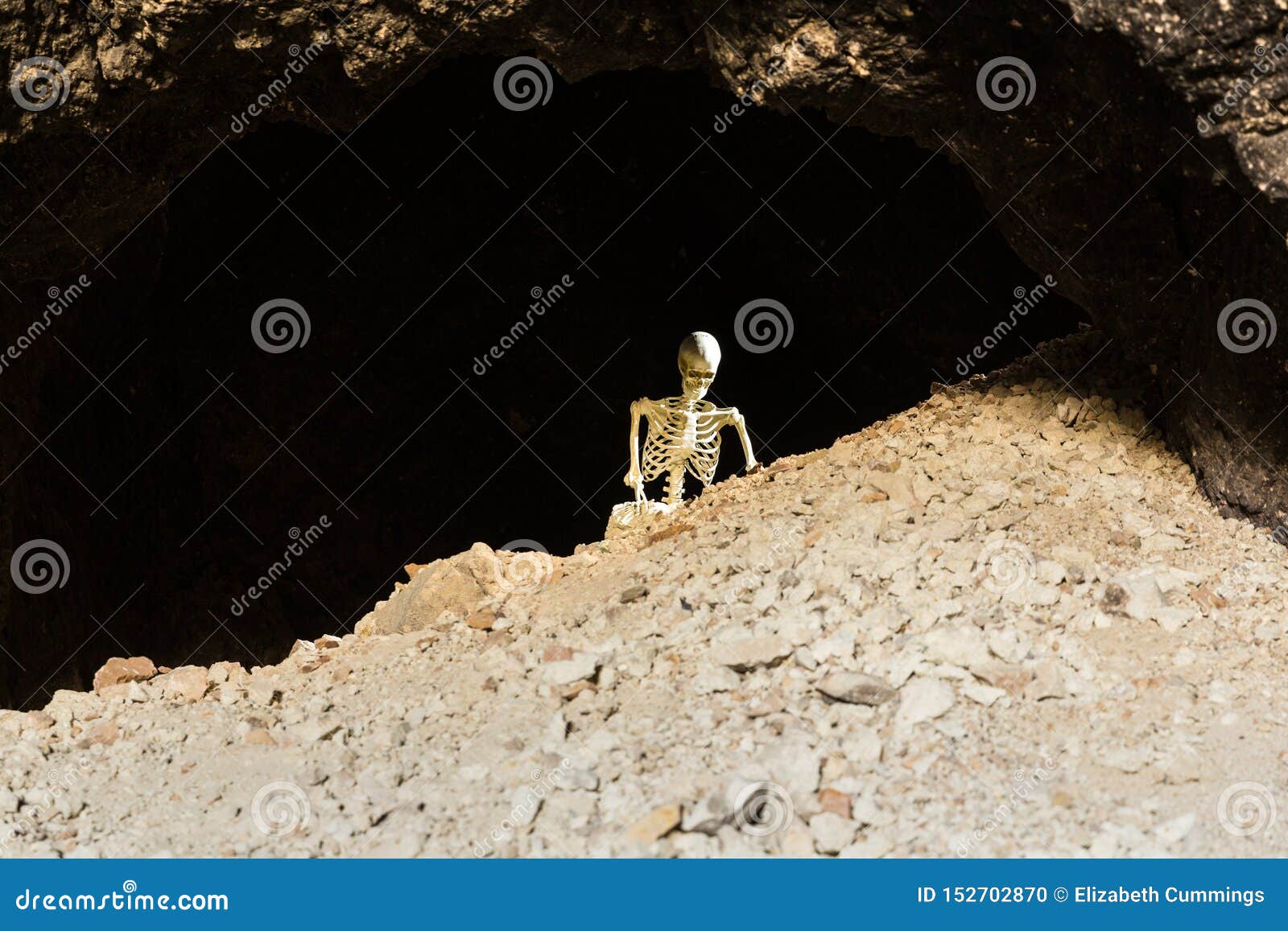 Skeleton in a Dark Cave in the Ground Crawling on Rocks Stock Photo ...
