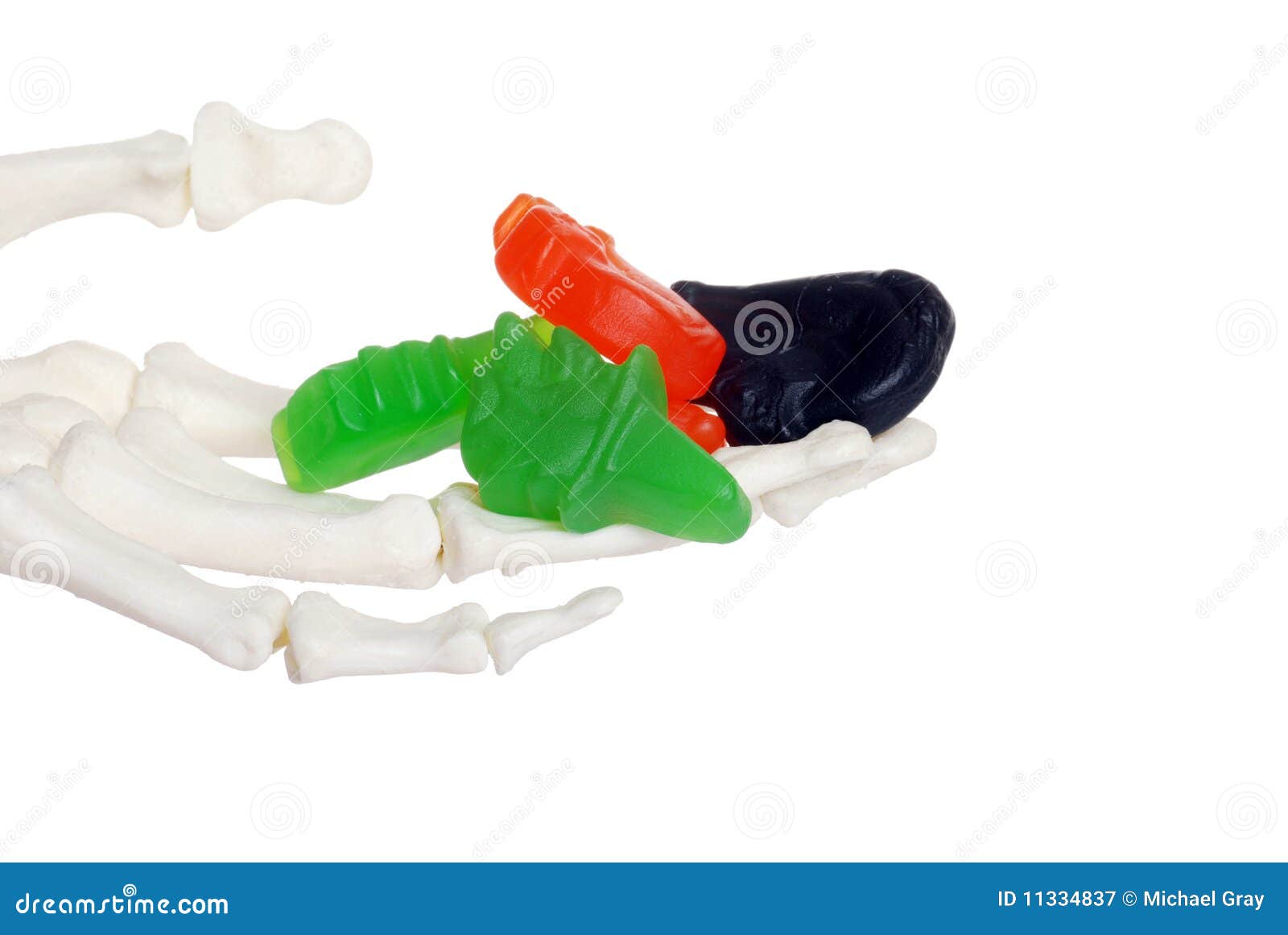 Skeleton Hand Holding Halloween Candy Stock Image - Image of fall ...