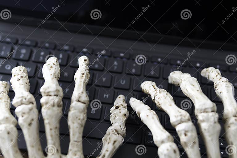 Skeleton Hands Typing a Report Using a Keyboard - Halloween Concept ...