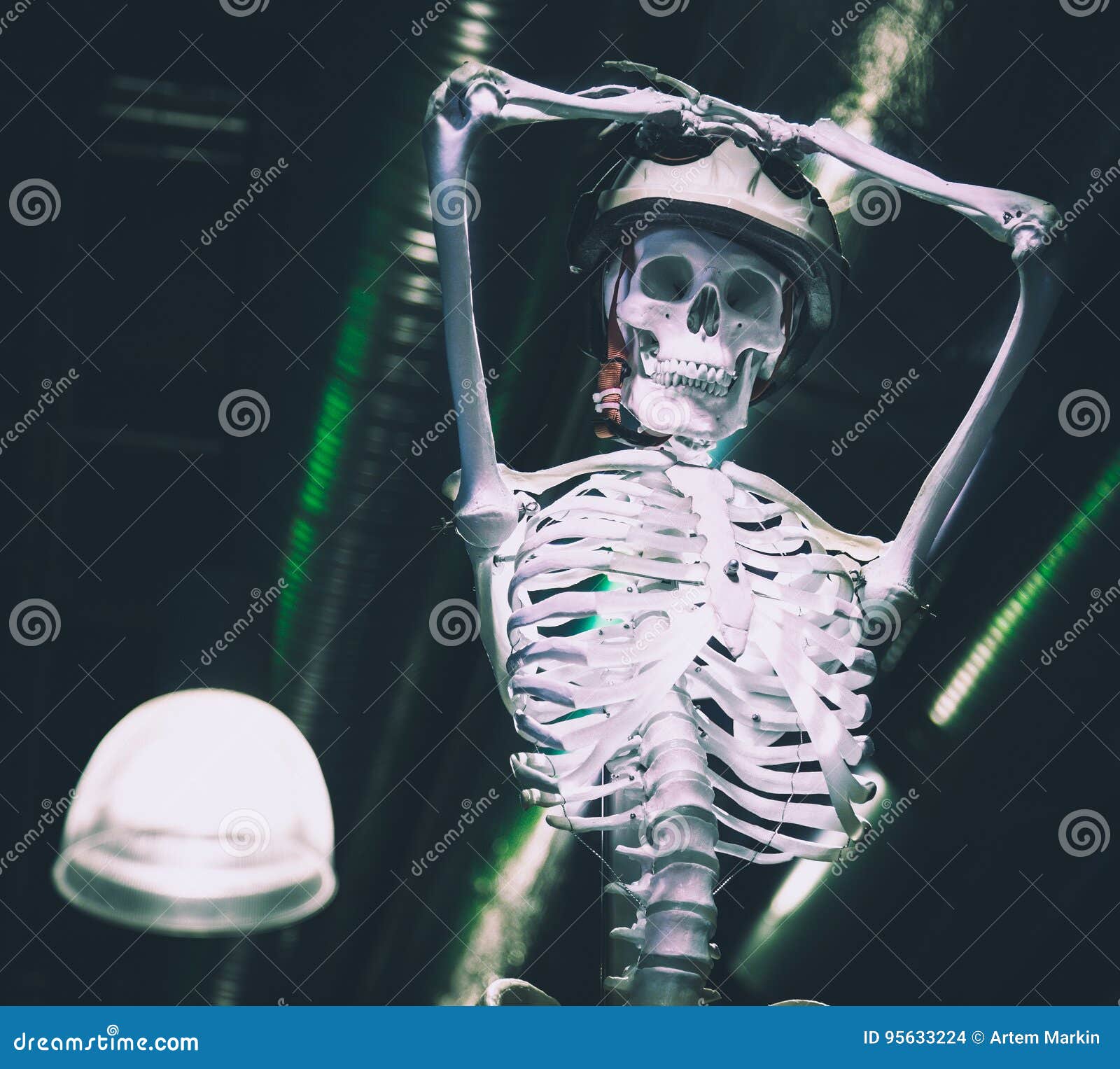 A Skeleton in a Helmet Poses with His Hands Up Stock Photo - Image of ...