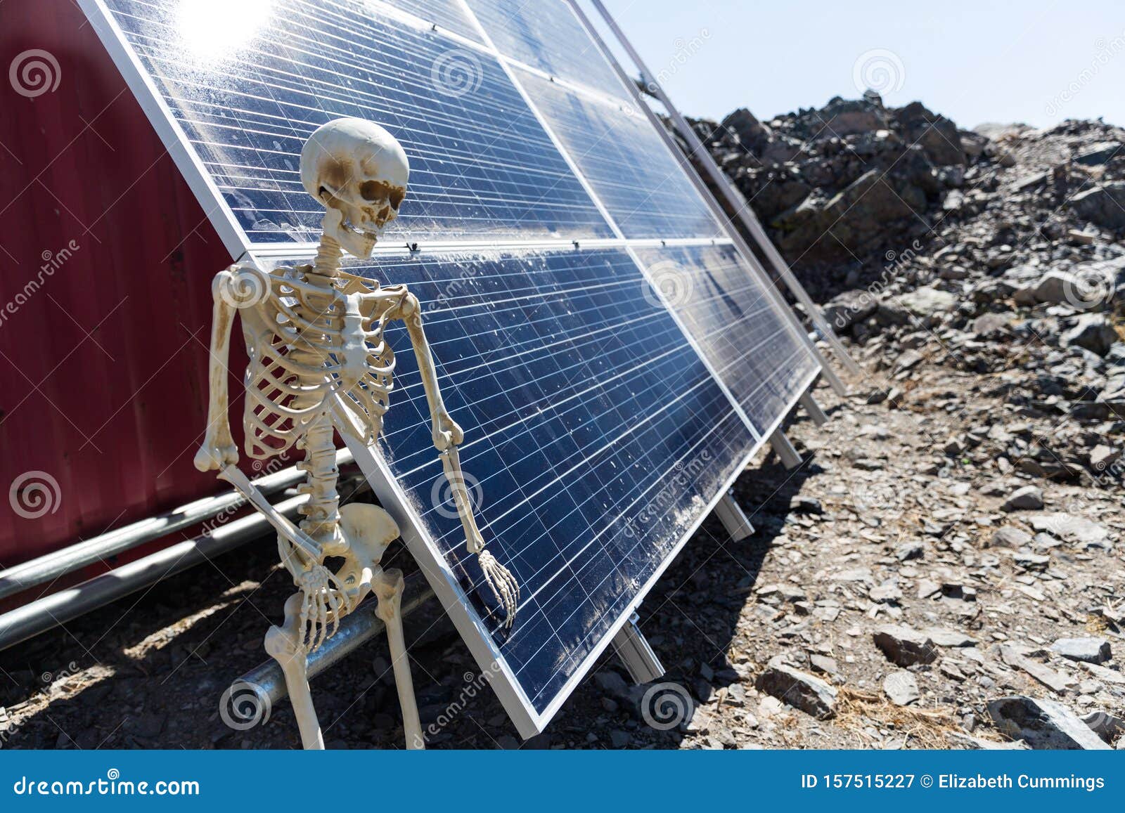 Skeleton Leaning On Solar Panels In The Desert Stock Photo ...