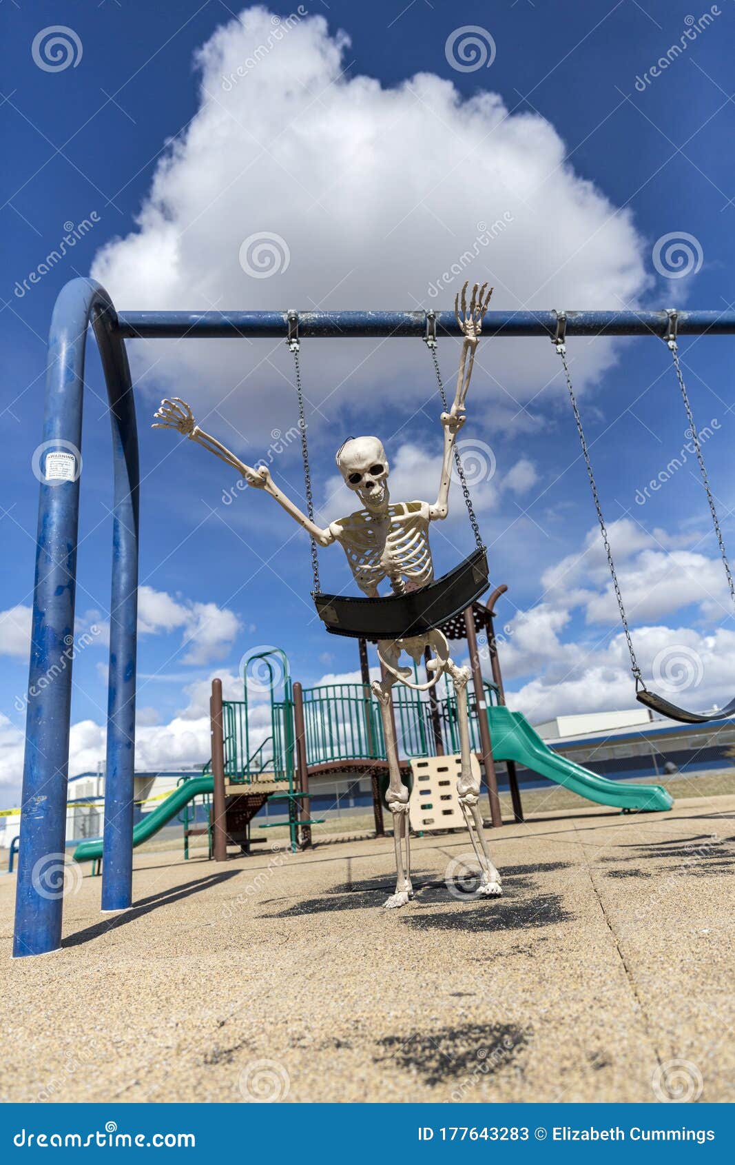 Skeleton Playing Superman on a Child S Swing in an Empty Park Stock ...