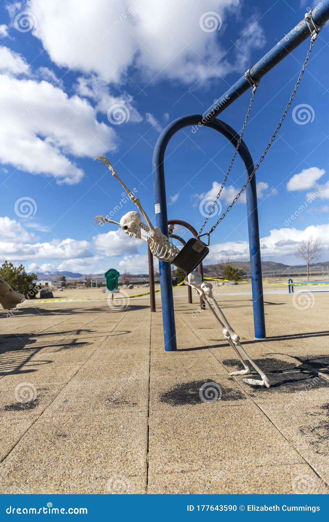 Skeleton Playing Superman on a Child S Swing in an Empty Park Stock ...