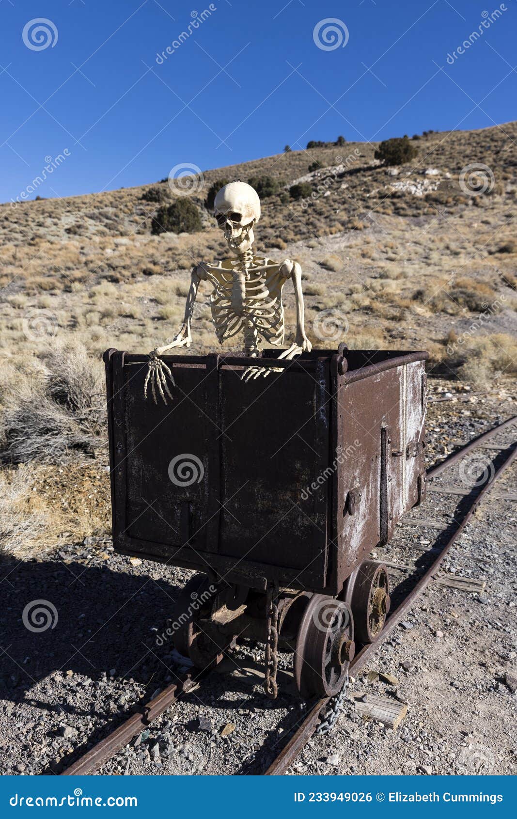 Skeleton Riding in an Ore Cart in the Desert Angled View Stock Photo ...