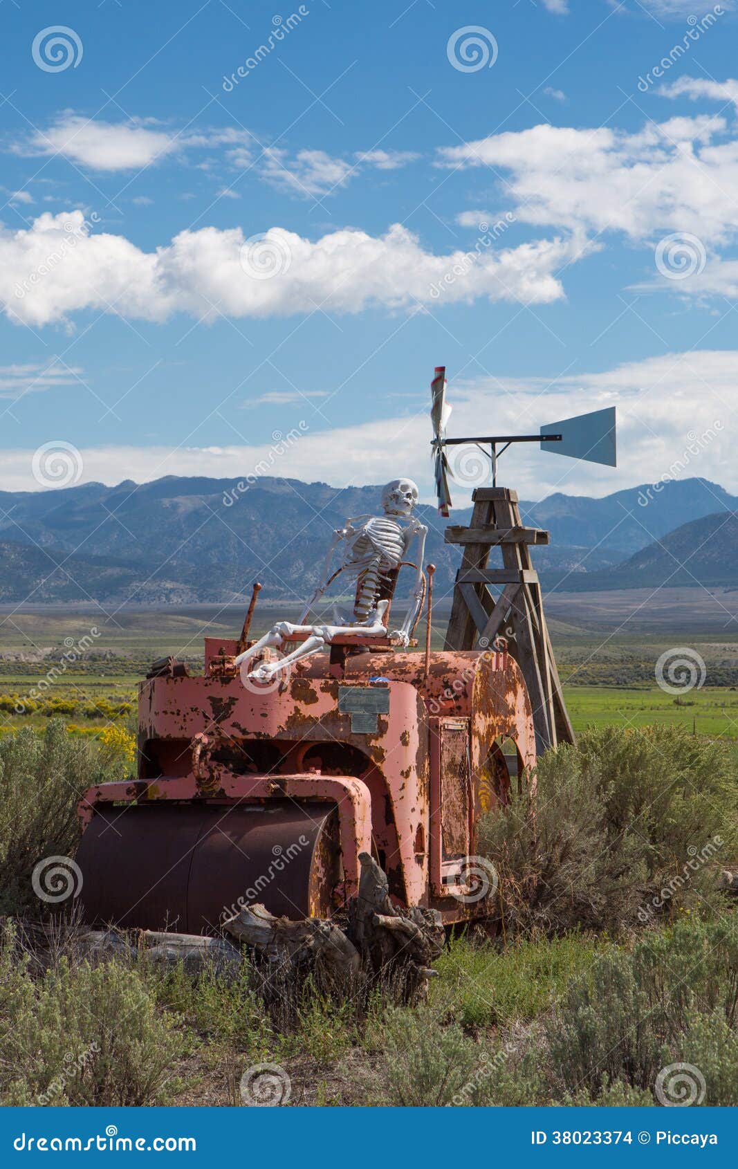 Skeleton Sitting on a Vintage Tractor in Utah with Mountains Stock ...