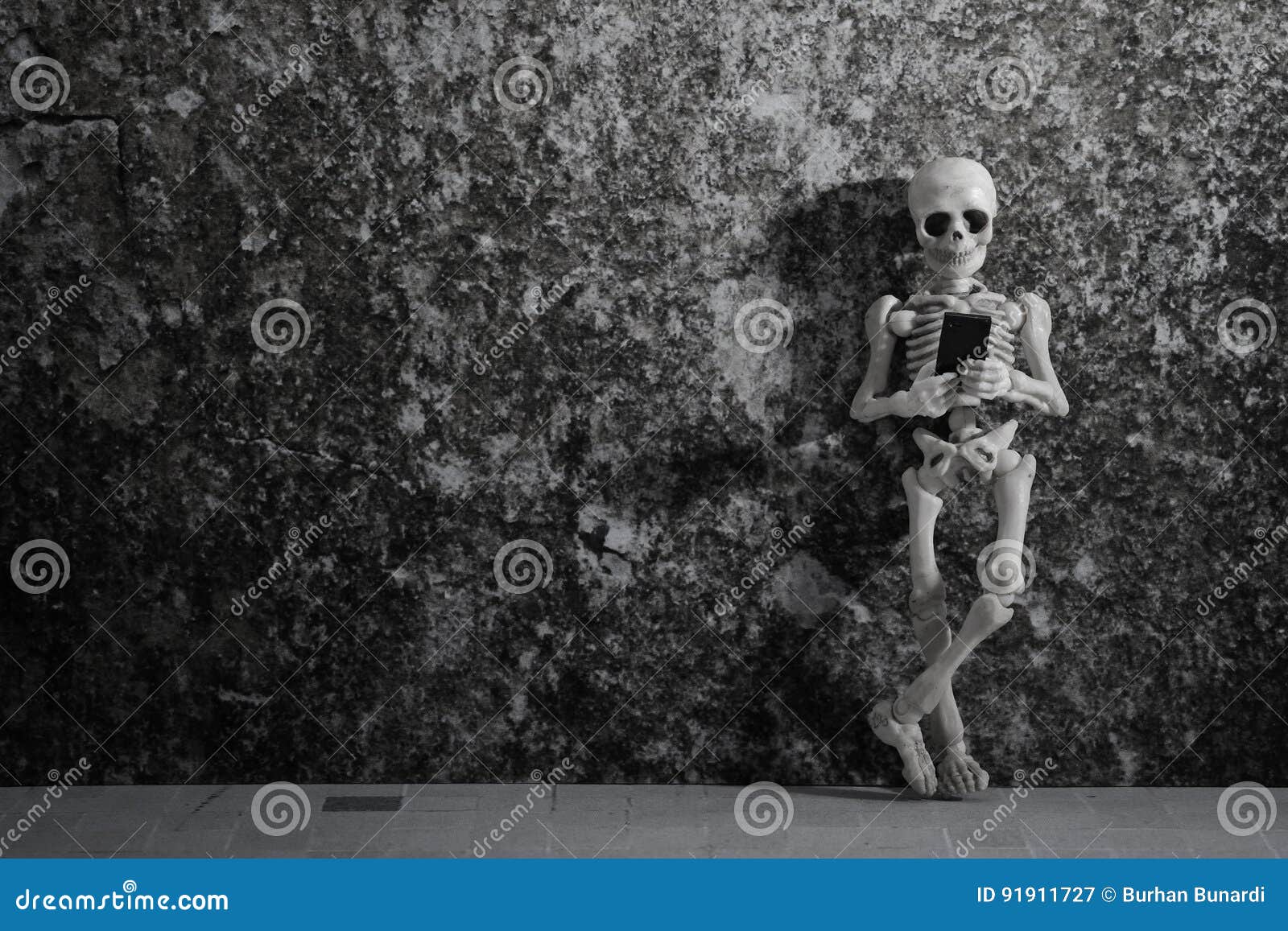 Skeleton and smartphone stock image. Image of lifestyle - 91911727