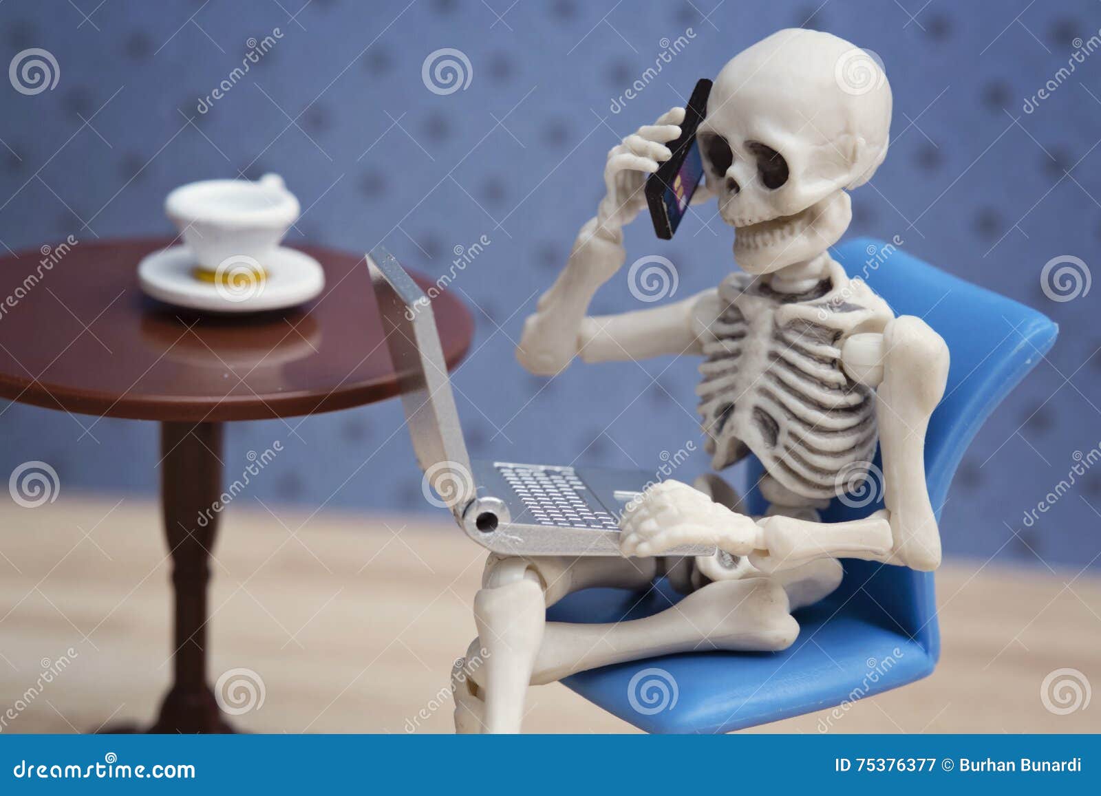 Skeleton works stock image. Image of phone, horror, anatomy - 75376377