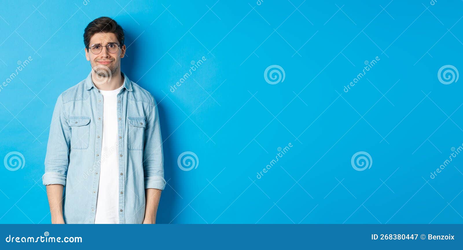 Skeptical and Doubtful Guy in Glasses, Looking Confused at Something ...