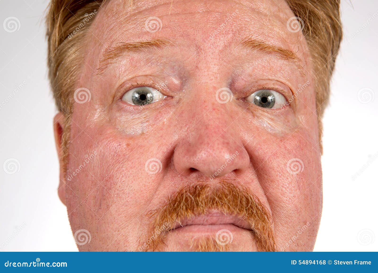 Skeptical Expression of Red Haired Man Stock Photo - Image of looking ...