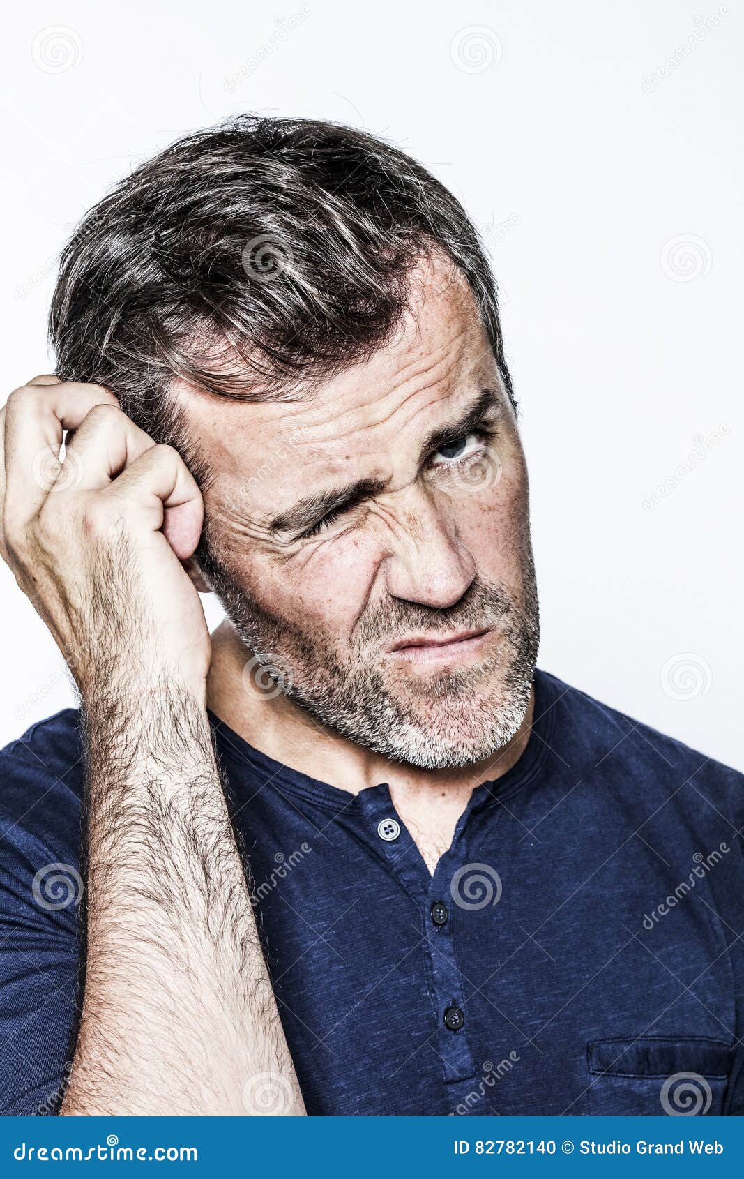 Skeptical Middle Aged Bearded Man Scratching His Head For Reflection