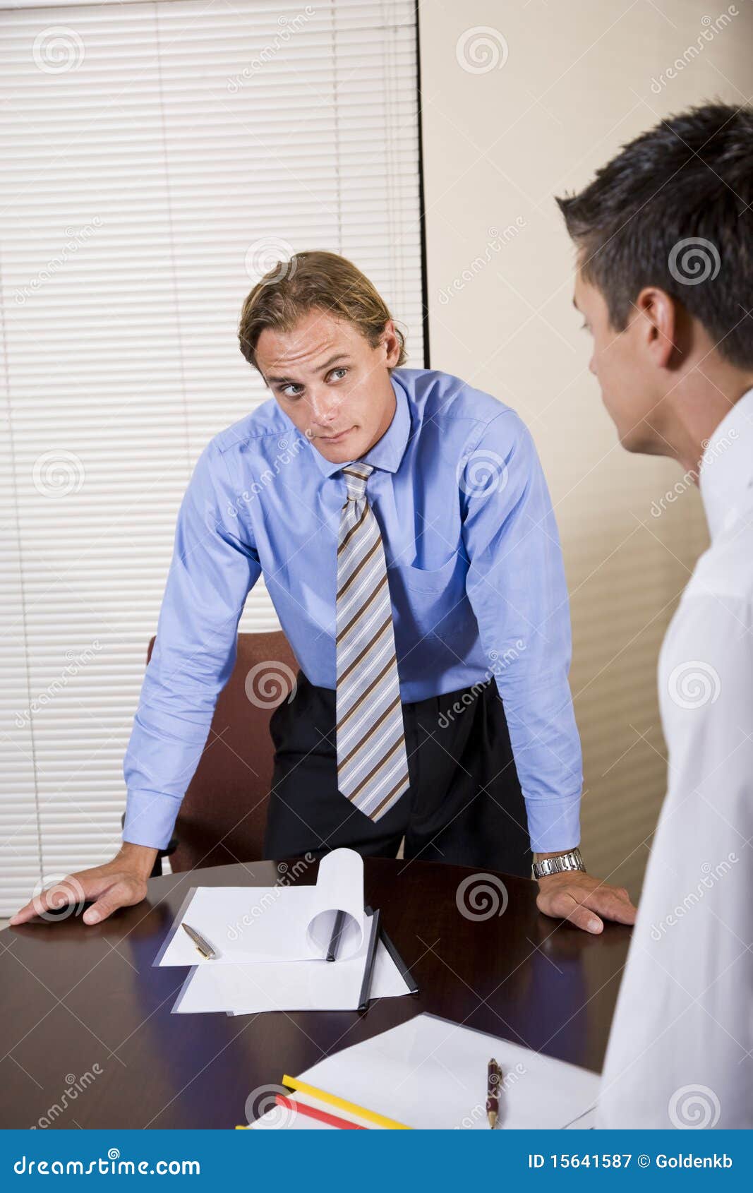 Skeptical Office Worker Looking at Colleague Stock Image - Image of ...