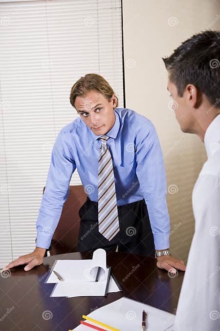 Skeptical Office Worker Looking at Colleague Stock Image - Image of ...