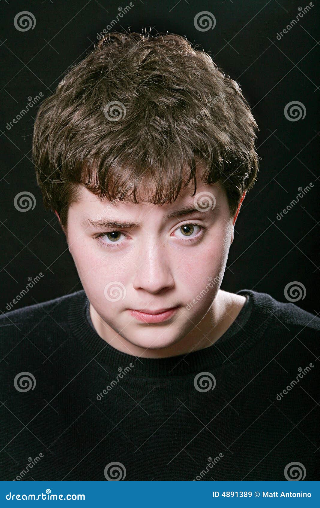 Skeptical Teen Boy Over Black Stock Image - Image of eyebrow ...
