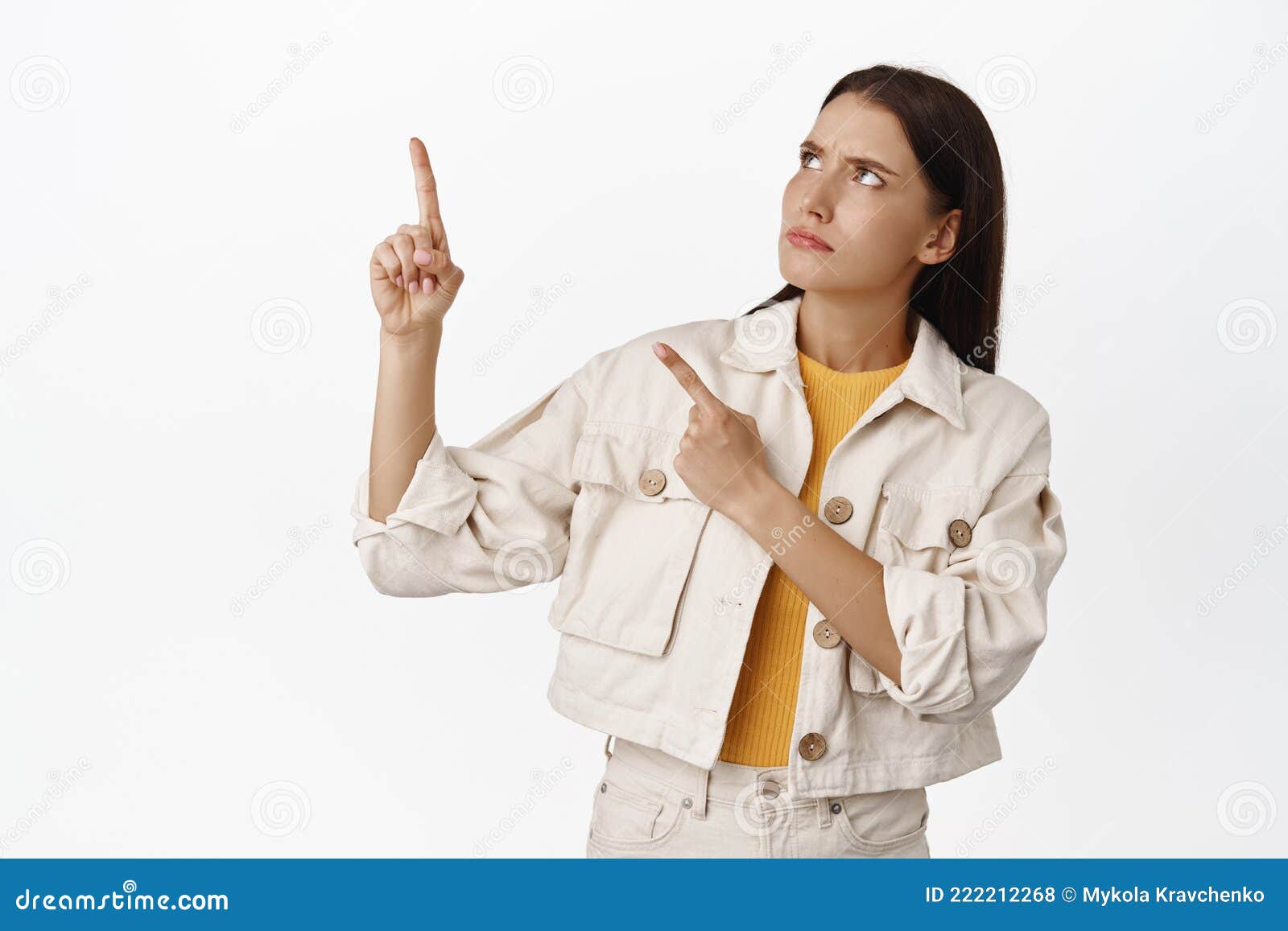 Skeptical Woman Furrow Eyebrows, Pointing and Looking at Upper Left ...