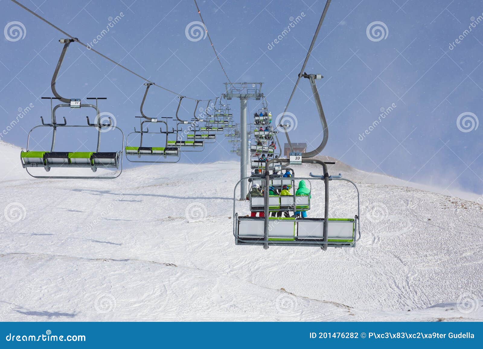 Ski lift in falling snow stock photo. Image of cable - 201476282