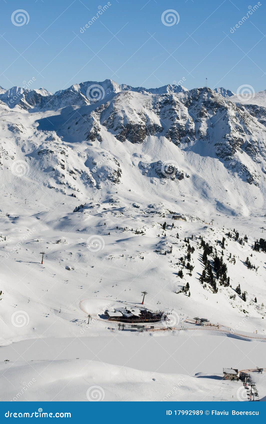 Ski slope in austrian alps stock image. Image of skiing - 17992989