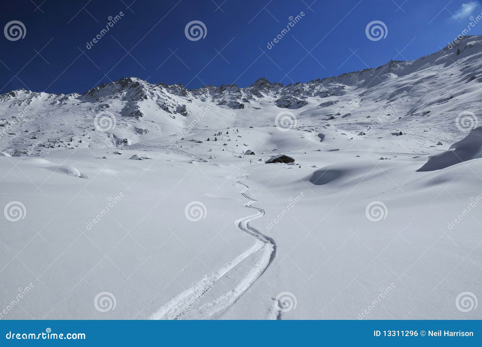 Ski tracks in the snow stock photo. Image of lodge, switzerland - 13311296