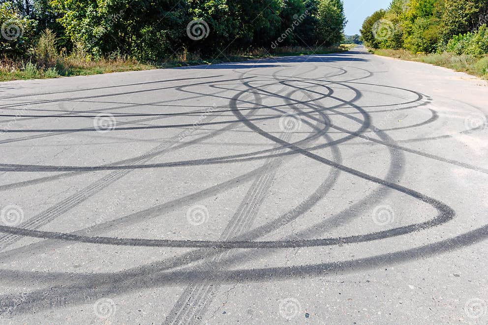 Skid Marks on a Road Surface. Circular Tire Marks Left by Drivers Doing ...