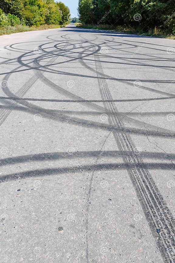 Skid Marks on a Road Surface. Circular Tire Marks Left by Drivers Doing ...