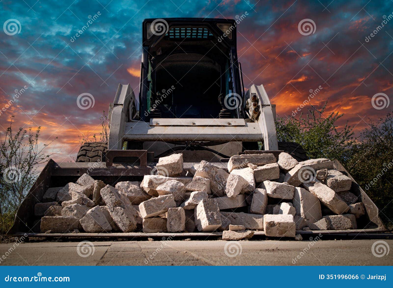 Skid Steer Loader for Construction Site with Loading Bucket Filled with ...