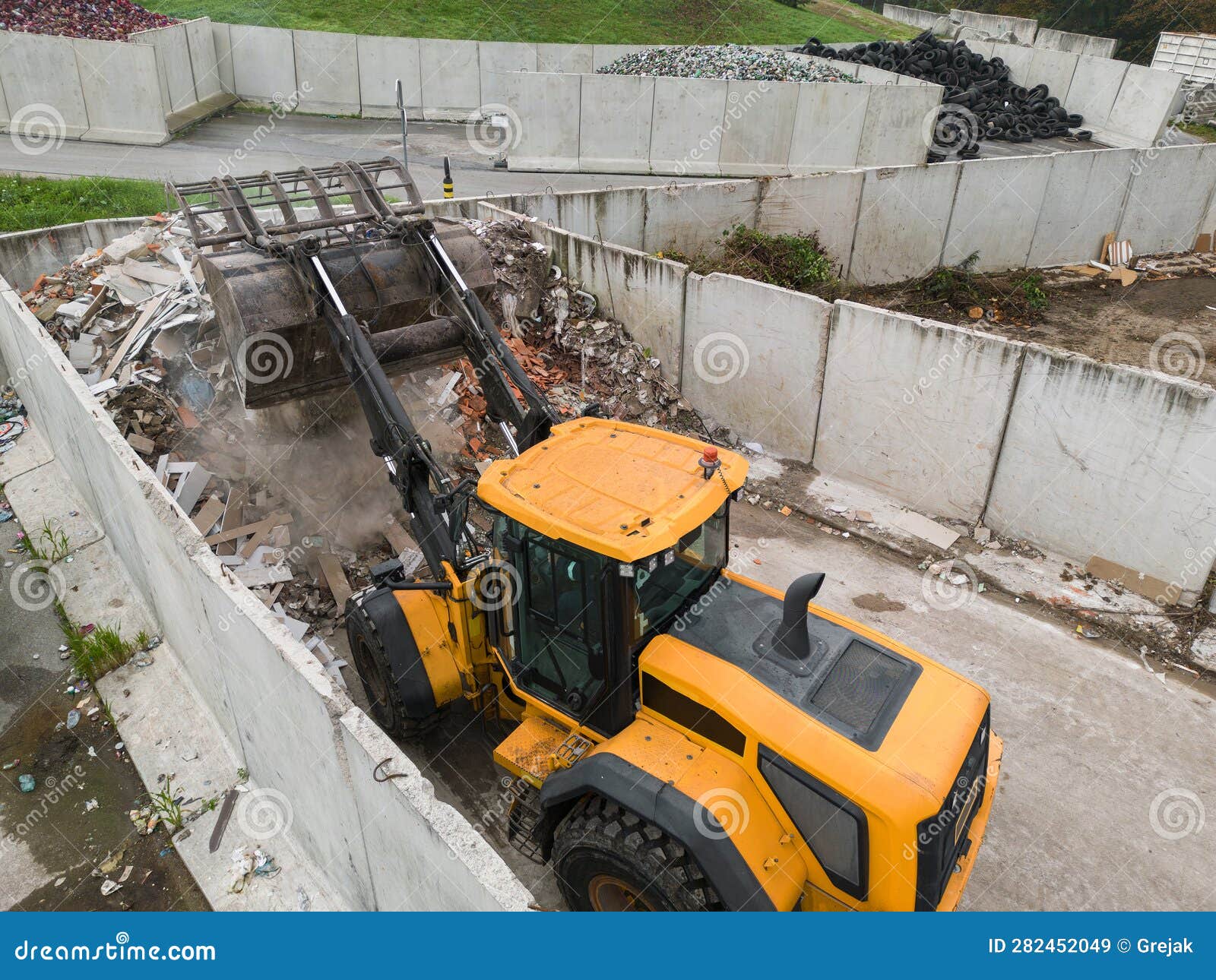 Skid Steer Loader Moving Waste Material, Shaking Out a Scrap Grapple ...