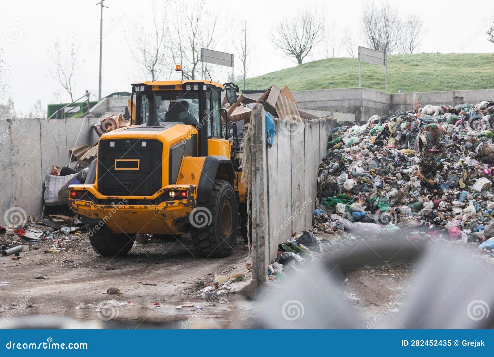 Skid Steer Loader Moving Waste Material, Shaking Out a Scrap Grapple ...