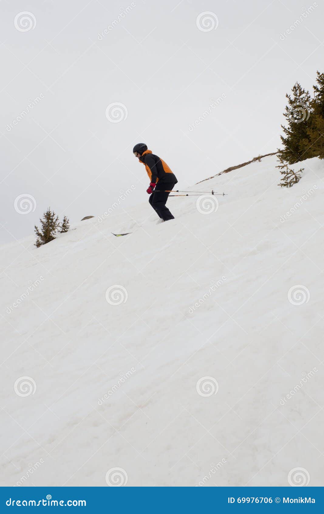 Skier going down the hill stock photo. Image of snow - 69976706