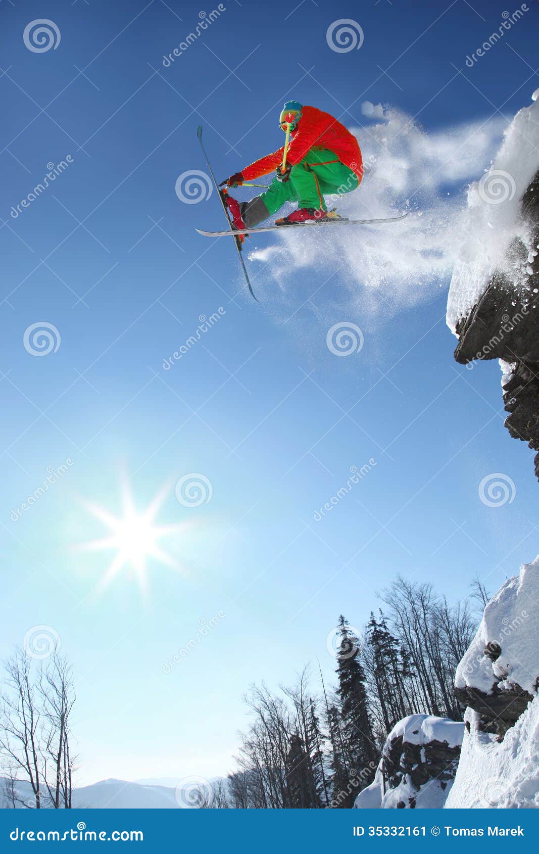 Skier Jumping Against Blue Sky from the Rock Stock Image - Image of ...