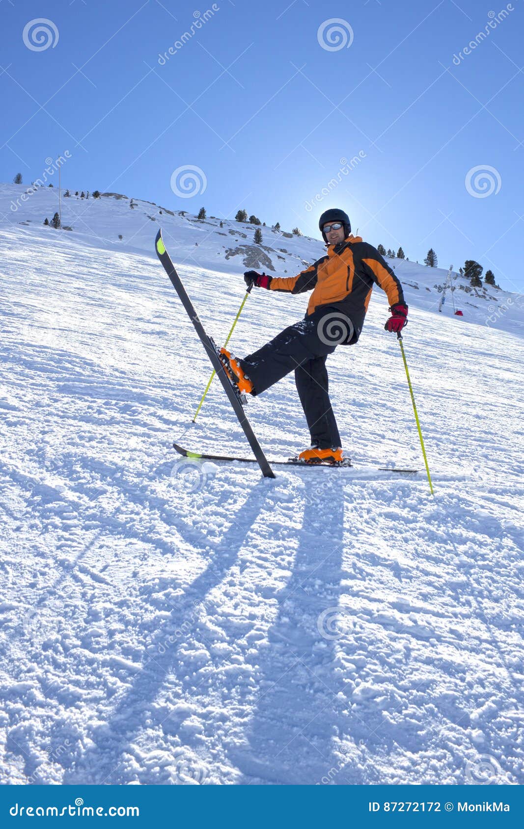 Skier Lifting His Leg with the Ski on Stock Photo - Image of sunny ...