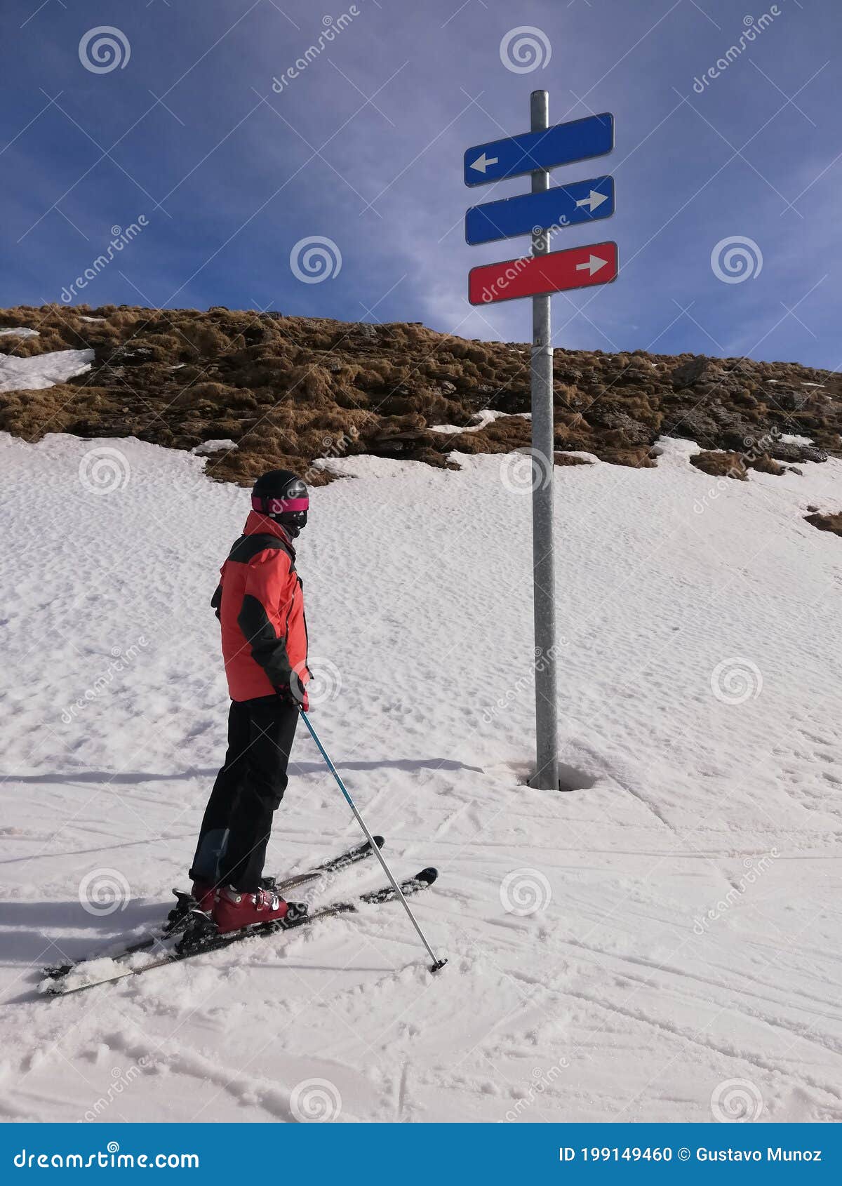 Skier Looking a Sign about the Level of Difficulty of the Slopes in a ...