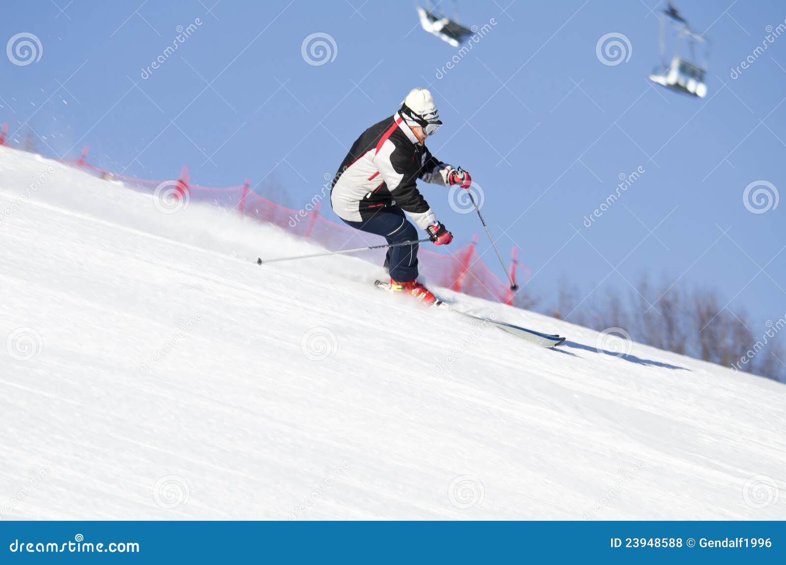 Skier on the mountain side stock photo. Image of side - 23948588