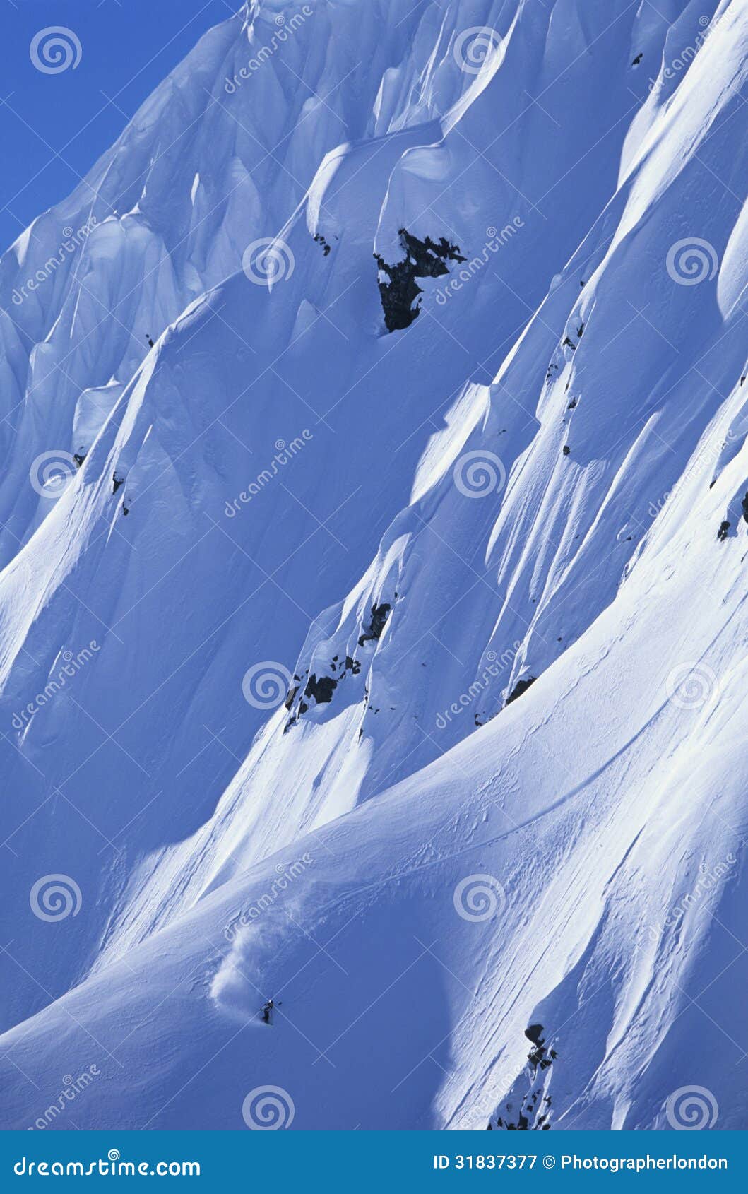Skier on Mountain Slope stock image. Image of action - 31837377