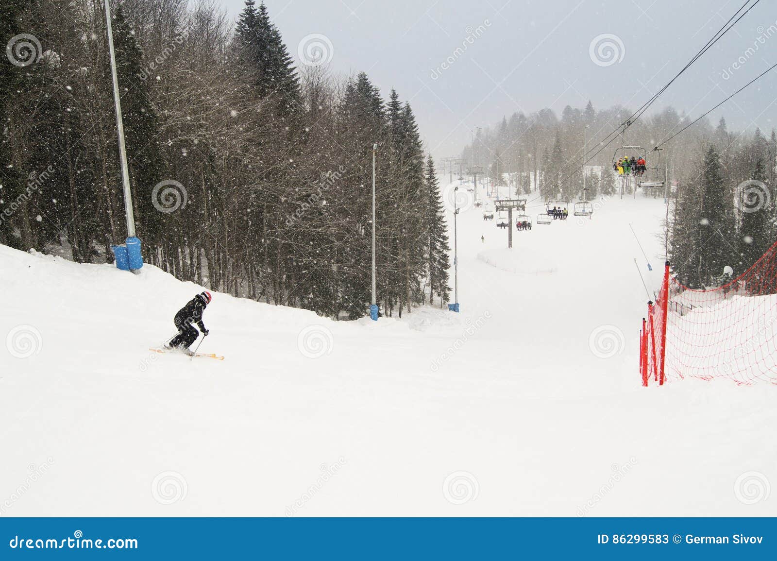 Skier on the ski slope. editorial stock photo. Image of cableway - 86299583