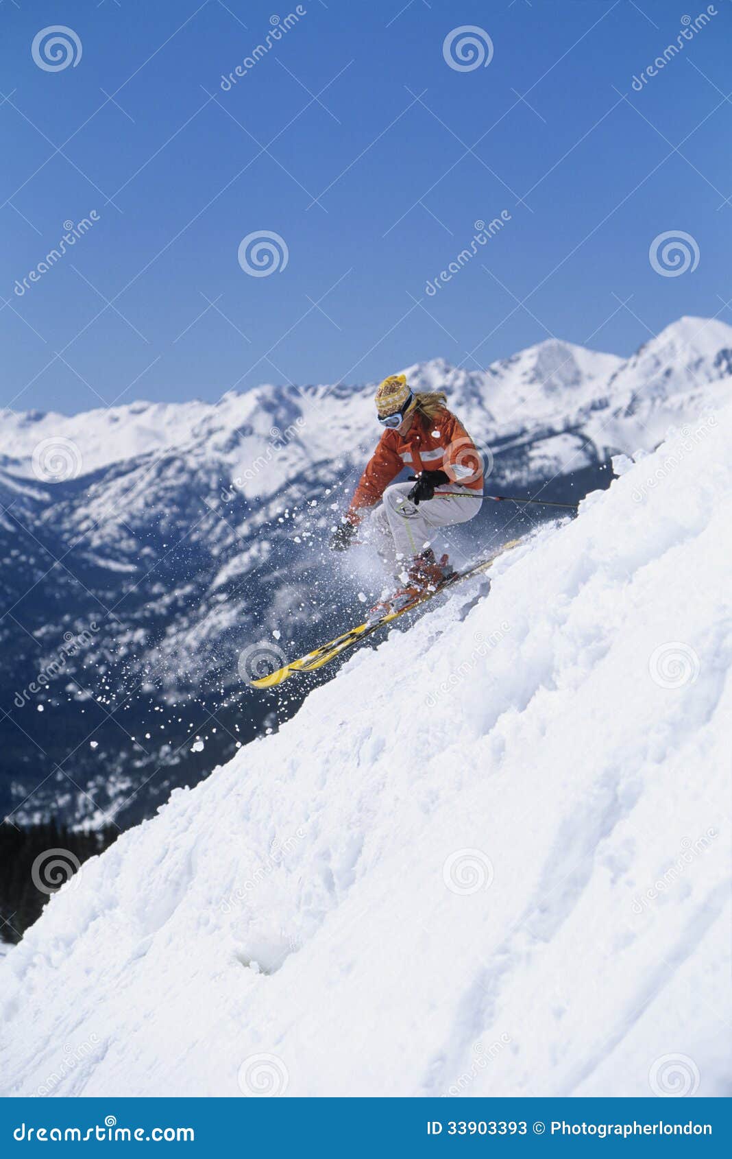 Skier Skiing Down Ski Slope Stock Image - Image of skiwear, jump: 33903393