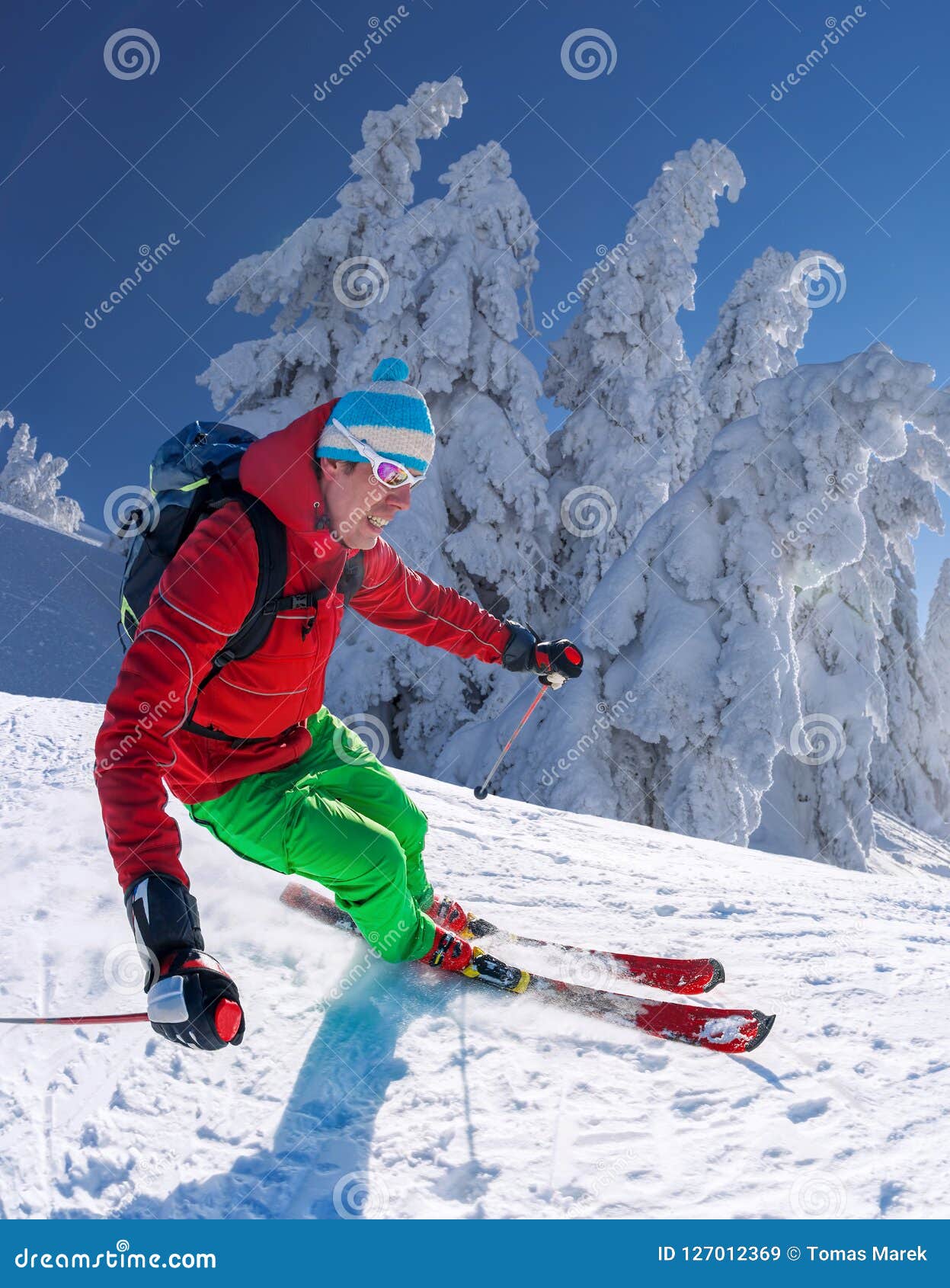 Skier Skiing Downhill in High Mountains Against Blue Sky Stock Image ...